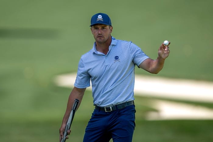 Three Hold Lead On Windblown Day